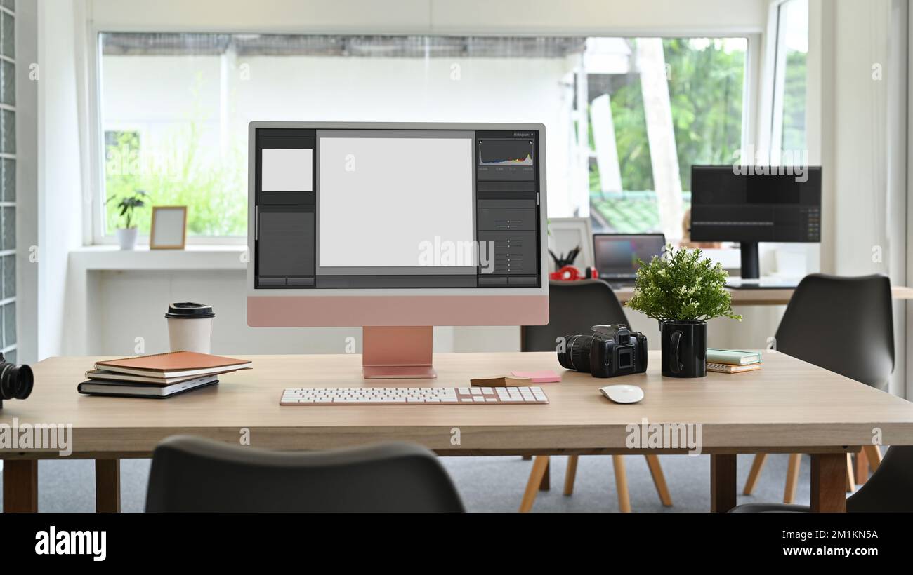 Creative office studio interior, photo editor workstation with blank ...