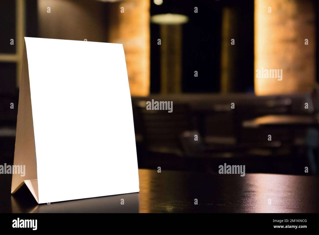 Mockup empty white label menu frame on table with cafe restaurant ...