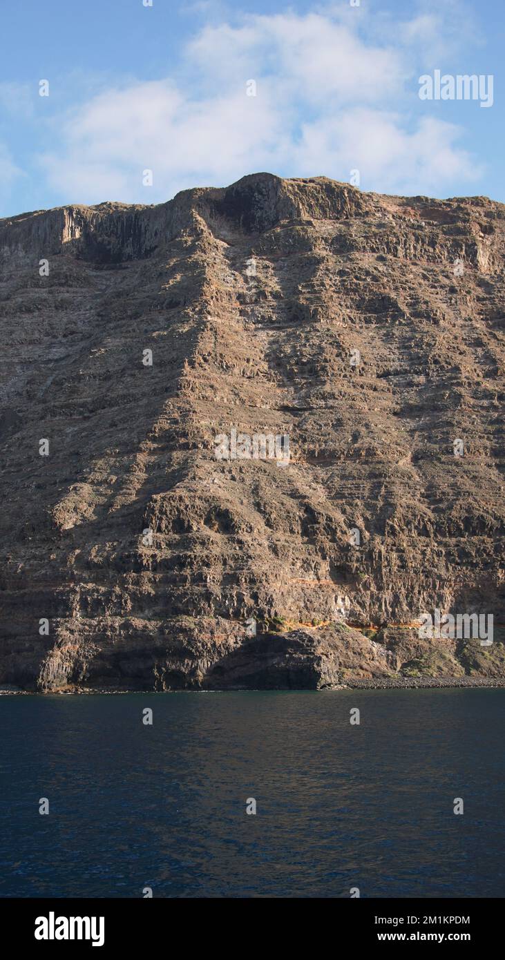 Giant cliff in the sea Stock Photo - Alamy