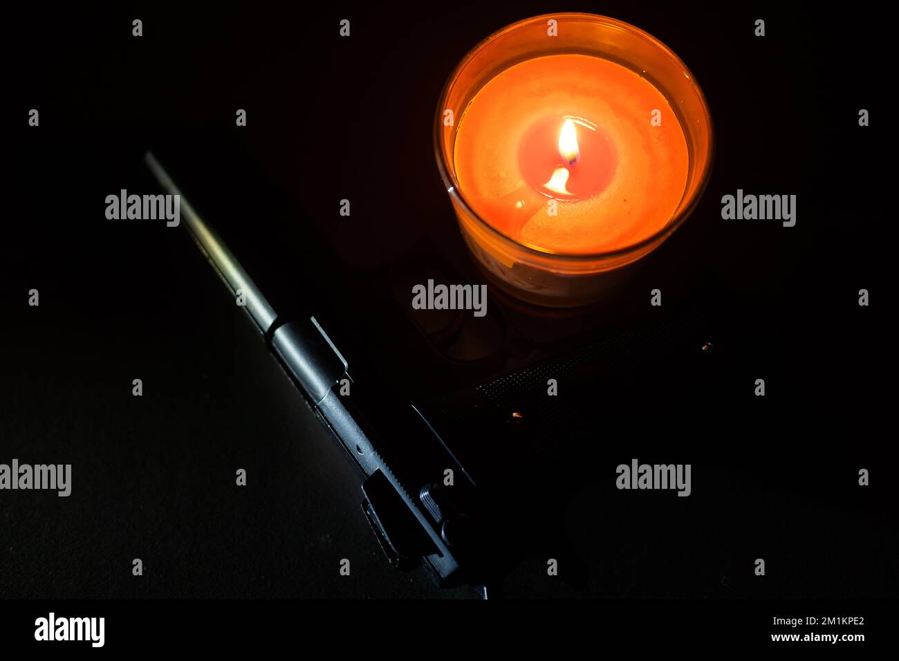 candle and a gun, criminal, crime, murder, weapons Stock Photo - Alamy