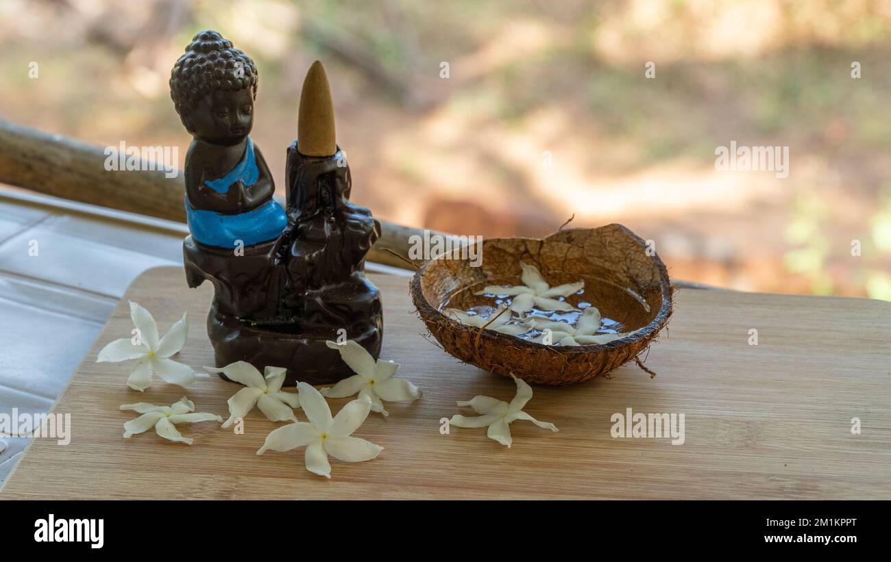 buddha figurine in meditation with incense sticks Stock Photo - Alamy