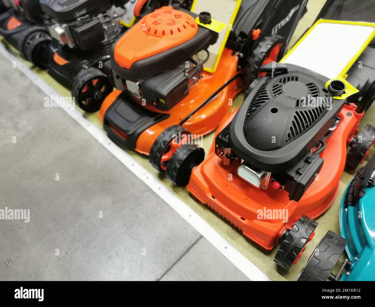 Lawn mowers are sold in the shop. Garden equipment in stock in the ...