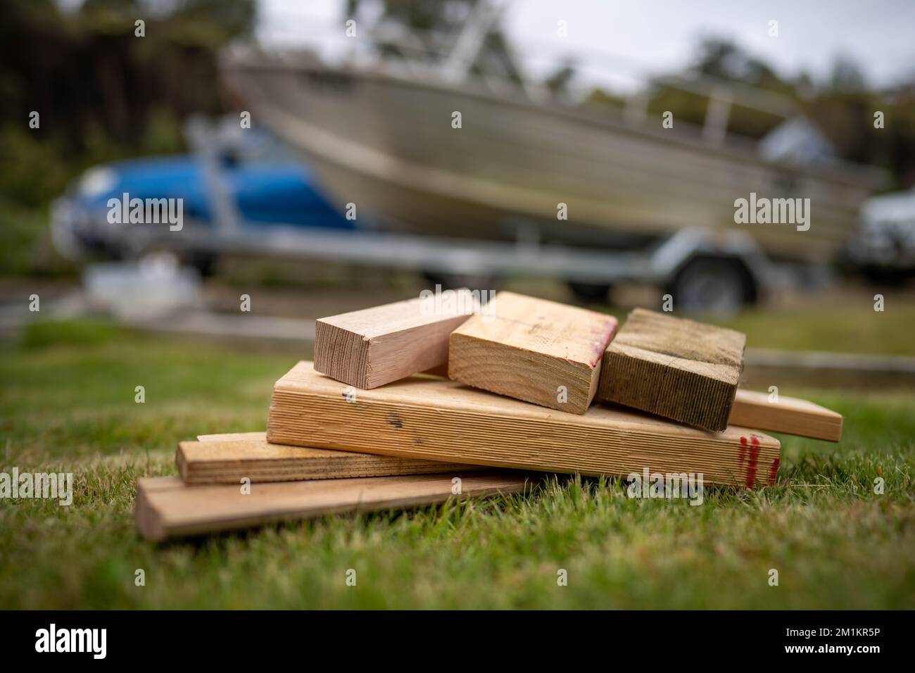 tyre blocks for a trailer in a park for camping Stock Photo - Alamy