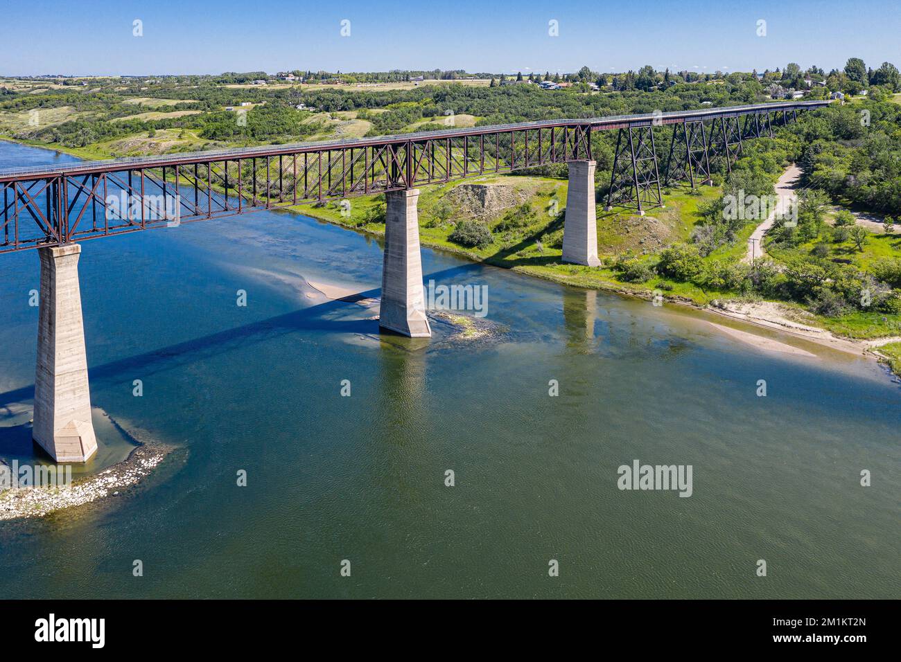 An aerial view over The Sky Trail Bridge by Lake Diefenbaker in ...