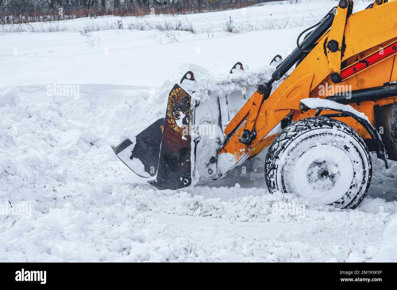 Tractor removes snow hi-res stock photography and images - Alamy