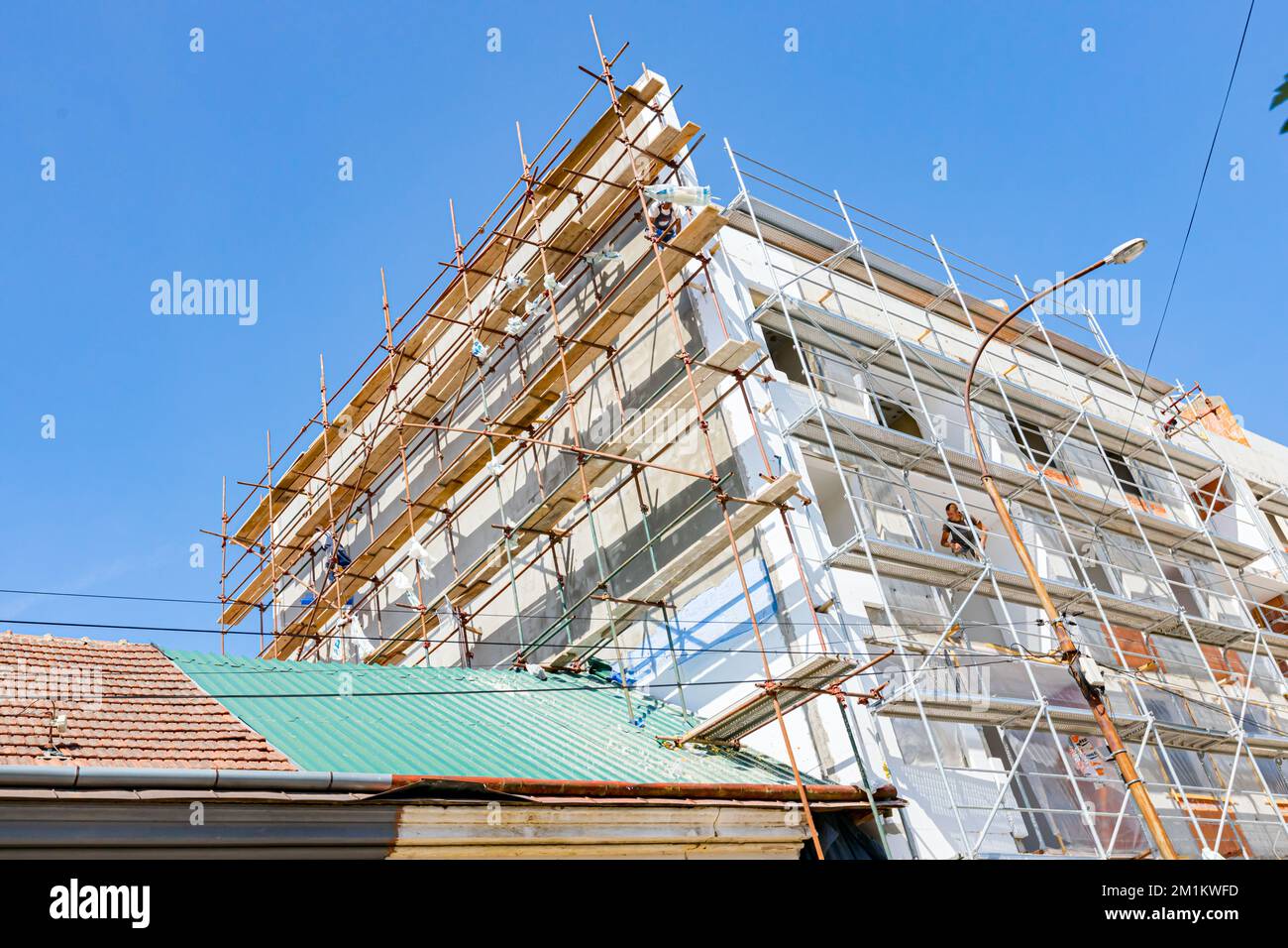 View on unfinished residential edifice, installation of Styrofoam, heat ...