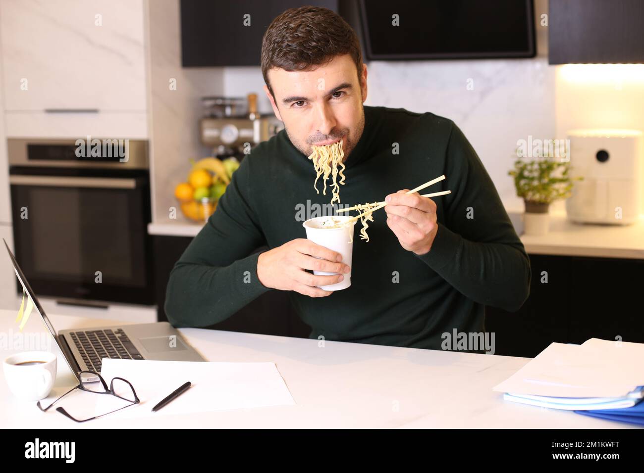 Businessman eating noodles hi-res stock photography and images - Alamy
