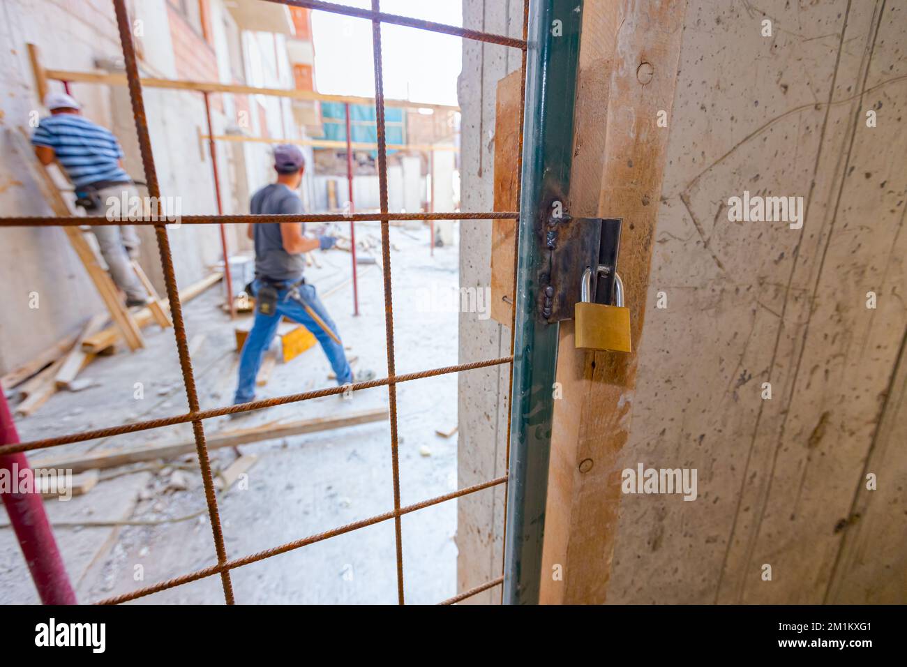 Close up view on metal lattice door, as a barrier, locked up with ...