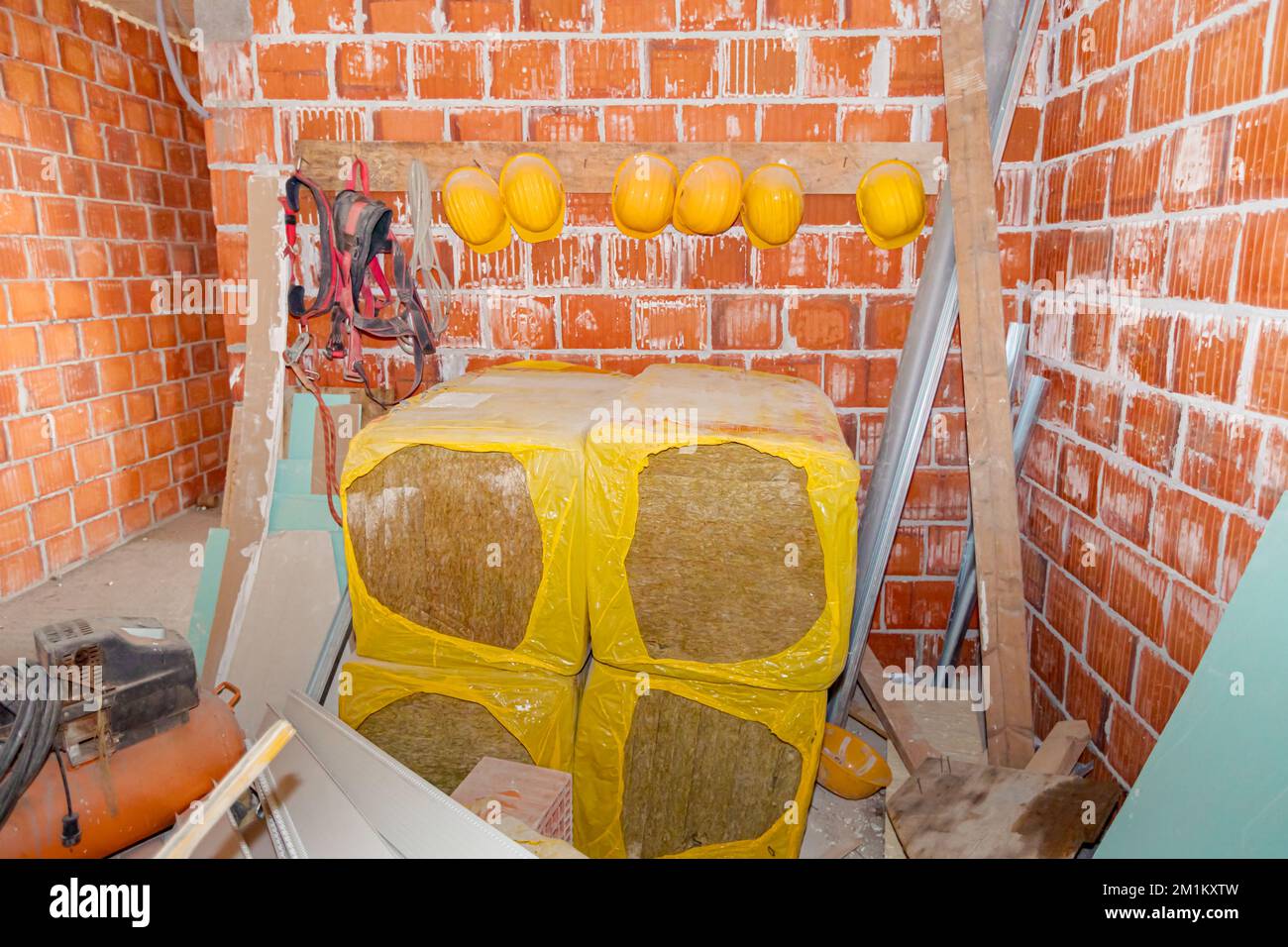 Package of thermal insulation material, rock wool and workers ...