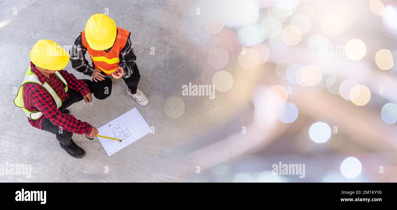 Architect and client discuss help create plan with blueprint of the ...