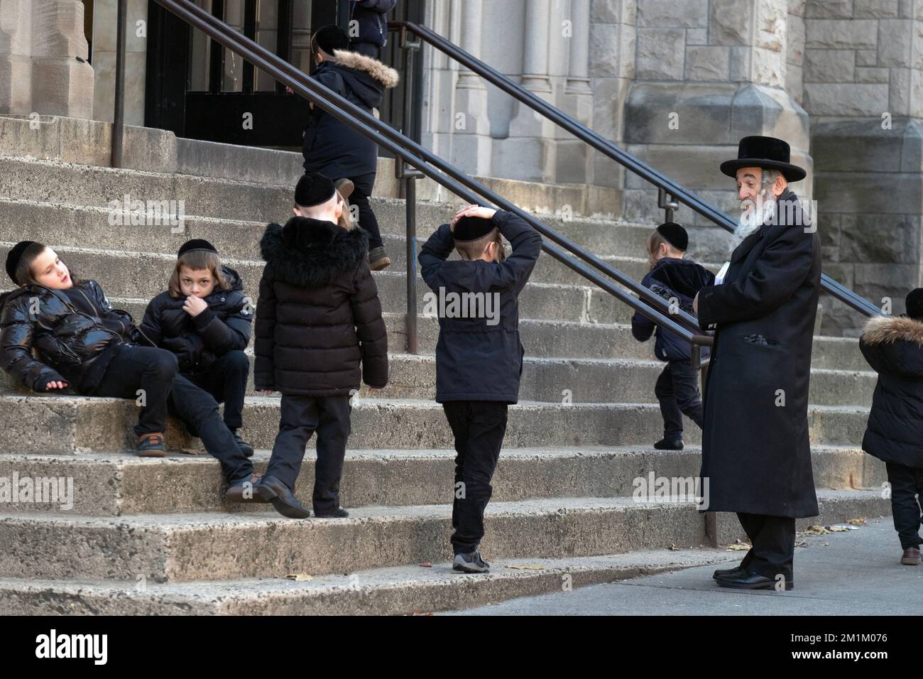 Yeshiva students reluctantly return to their classroom after recess. In ...