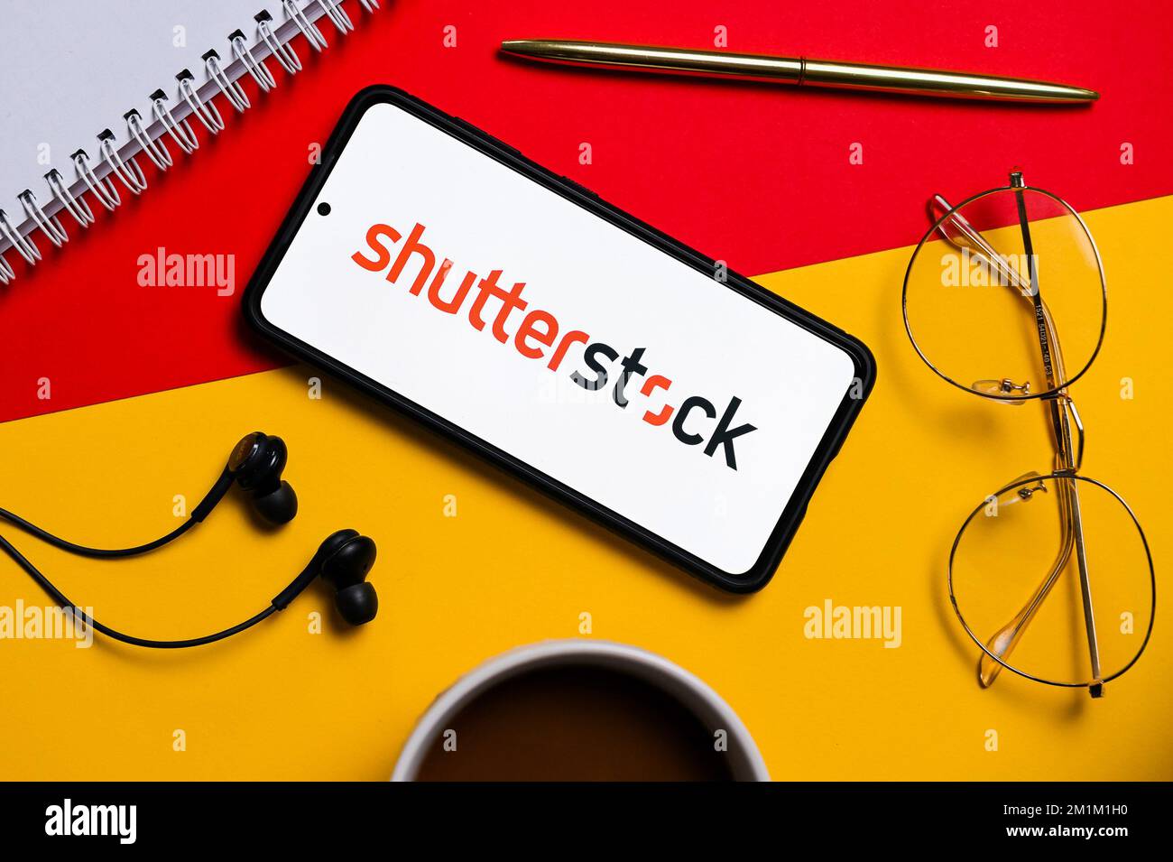 In this photo illustration, a Shutterstock logo seen displayed on a ...