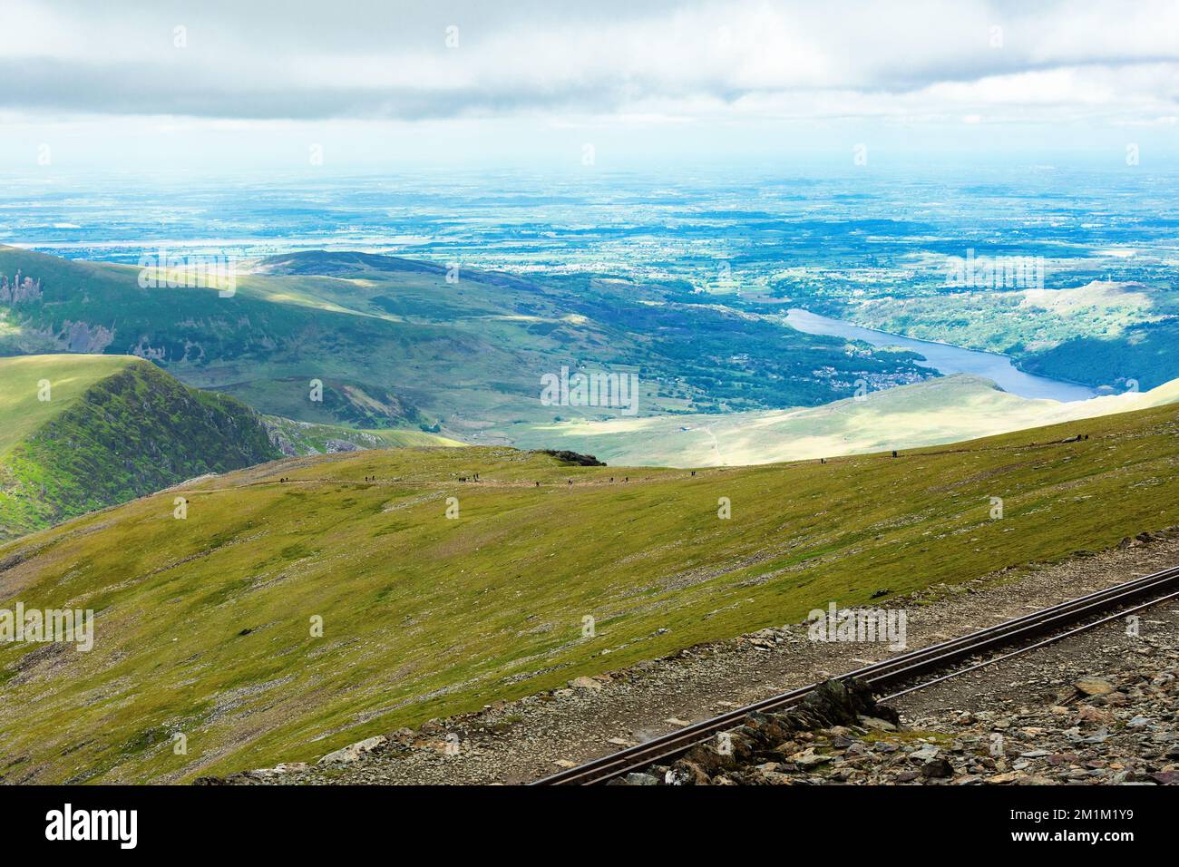Climbing up mount Snowdon in North Wales. View of the hills and ...