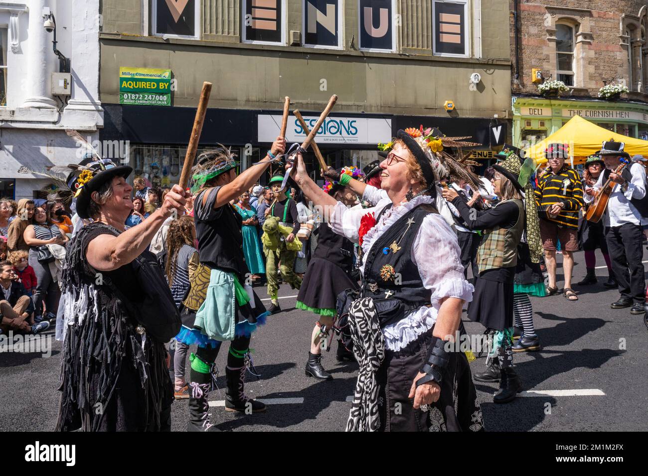 Penzance Pensans Morris dancing in a parade on Mazey Day in the the ...