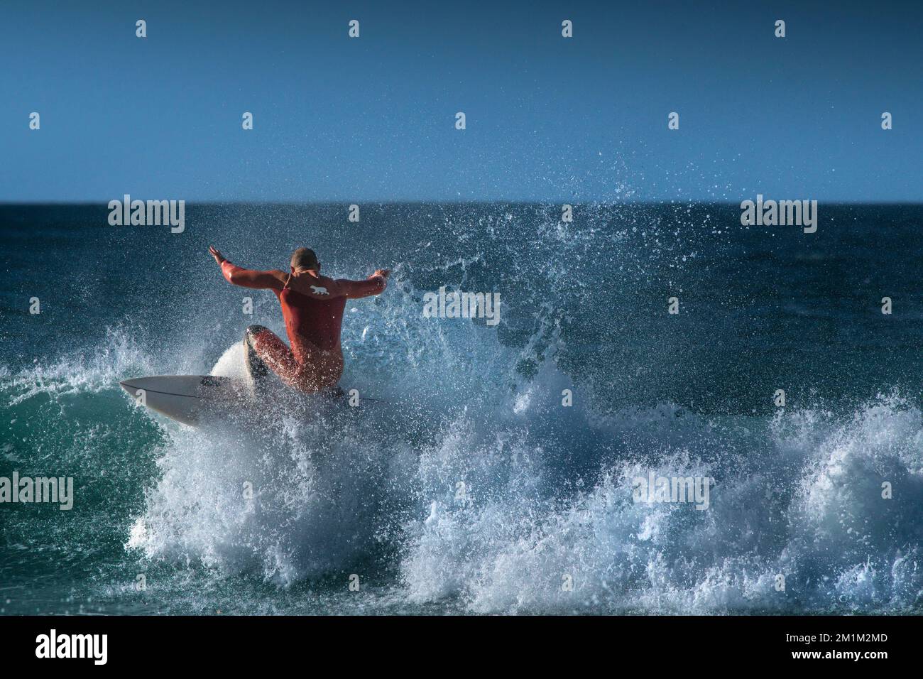 Spectaular surfing action as a male surfer rides a wave at Fistral in ...