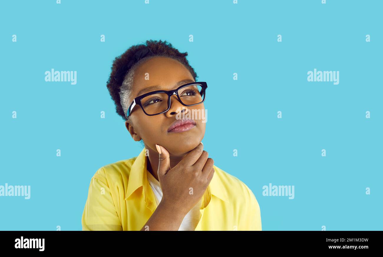 Portrait of pensive woman who has doubtful expression on her face ...