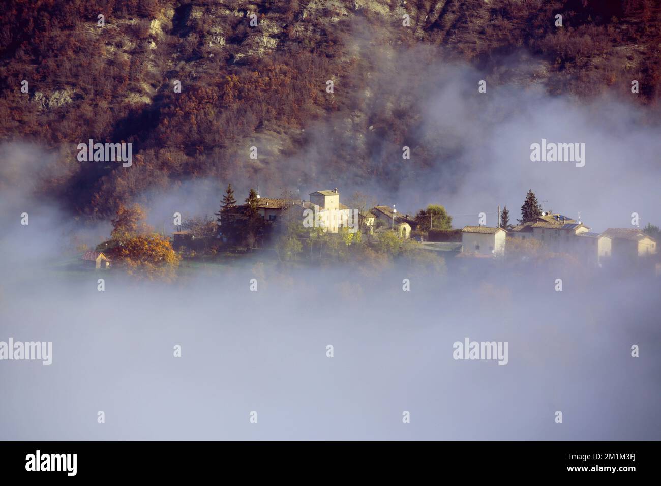 Autumn landscape of the Tuscan-Emilian Apennines with fog Stock Photo ...