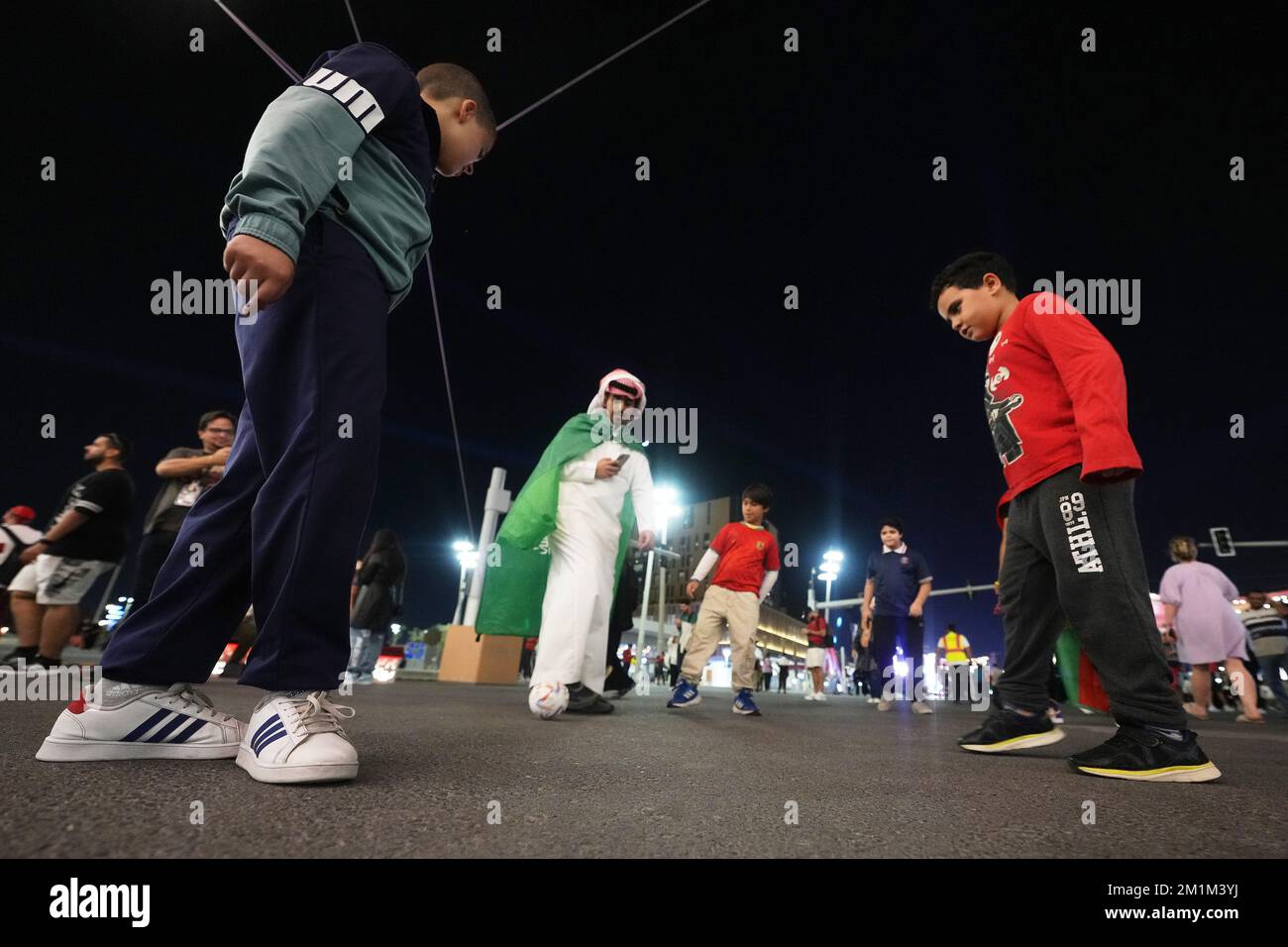 Lusail, Qatar. 28th Nov, 2022. Children's playing football with a ...