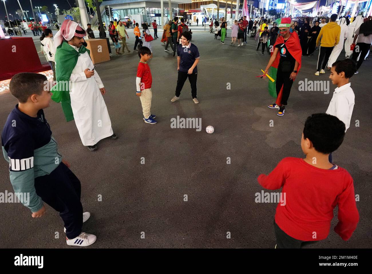 Lusail, Qatar. 28th Nov, 2022. Children's playing football with a ...