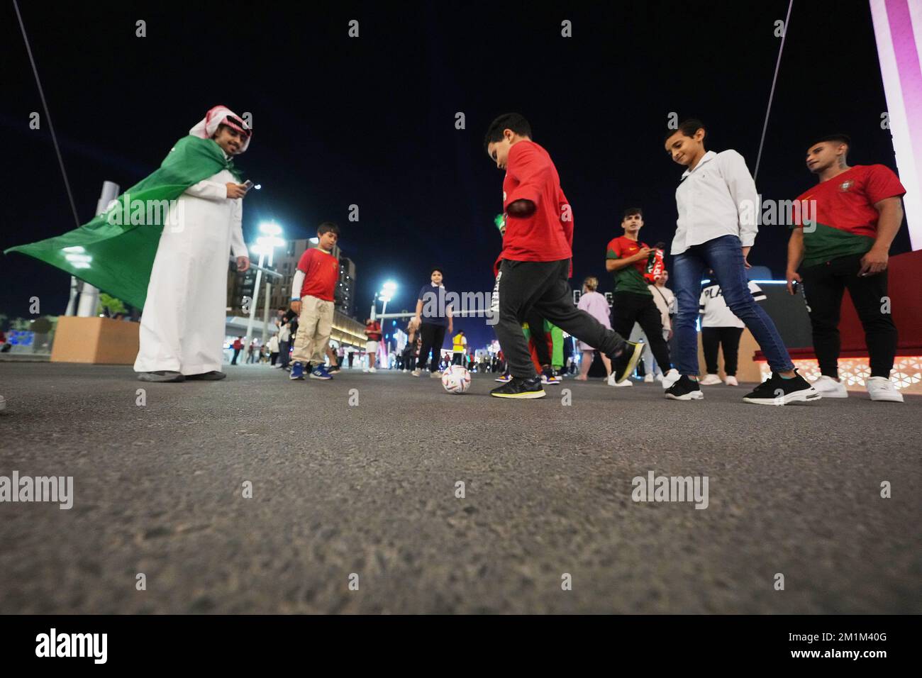 Lusail, Qatar. 28th Nov, 2022. Children's playing football with a ...