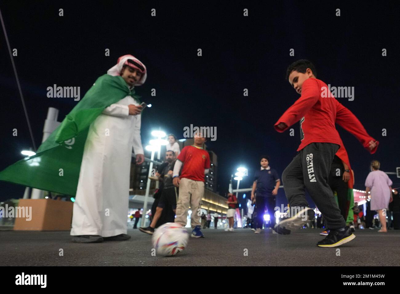 Lusail, Qatar. 28th Nov, 2022. Children's playing football with a ...