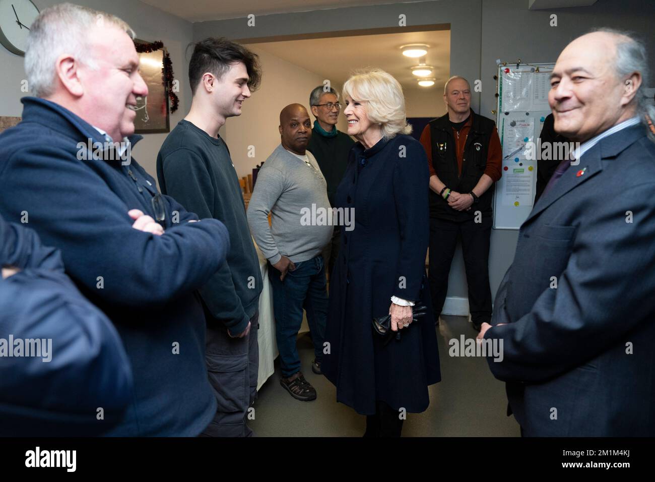 The Queen Consort speaks to staff and companions during a visit to the ...