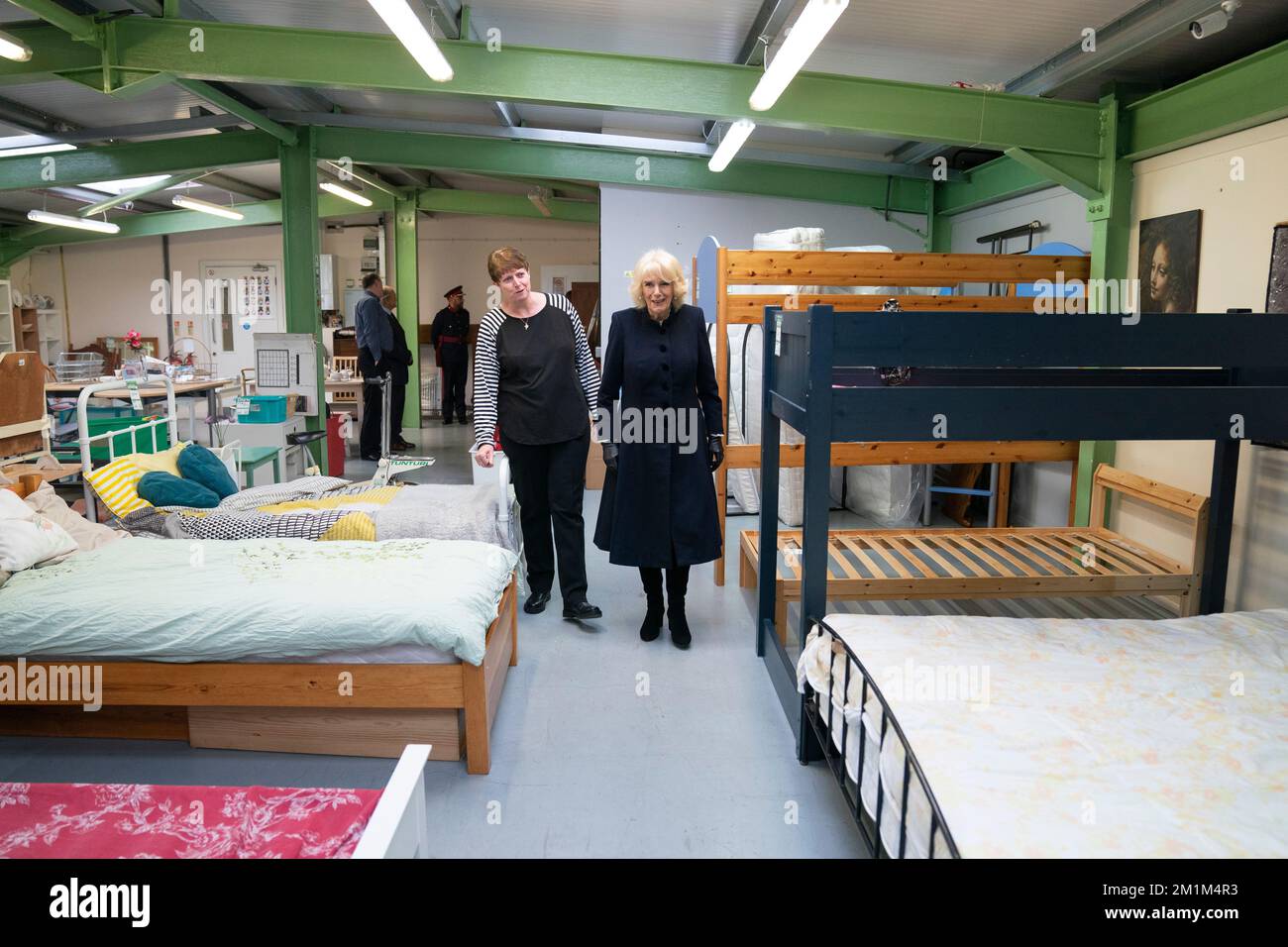 The Queen Consort is given a tour by the Head of Business Rachael ...