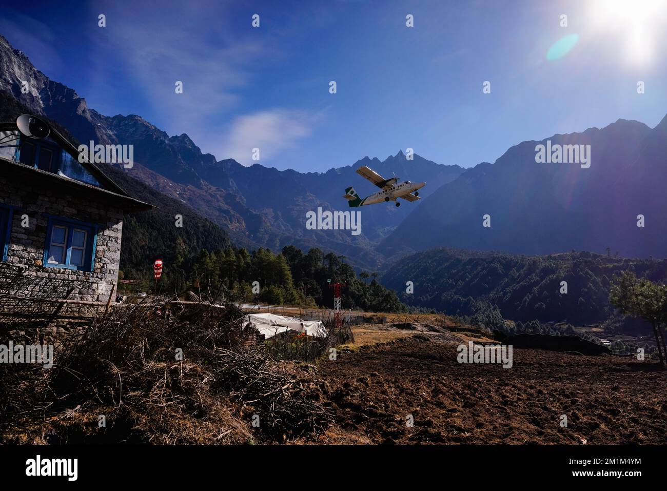 Lukla, Nepal. 13th Dec, 2022. An aircraft takes flight from the runway ...