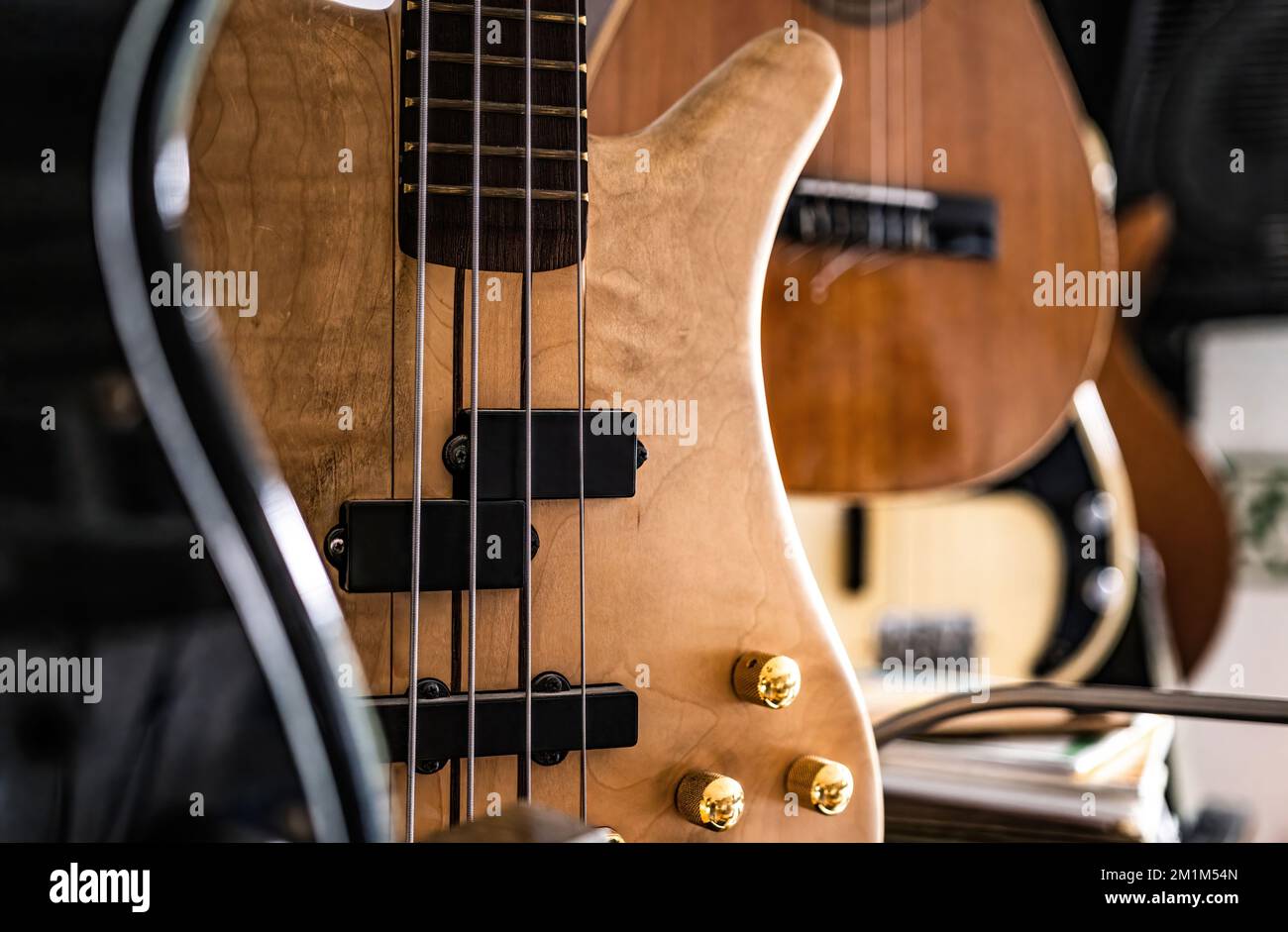 Bass guitar fretboardsand strings in music recording studio Stock Photo ...