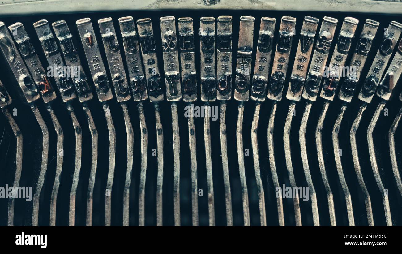Typo keys of a old manual typewriter typing on a retro writing machine ...