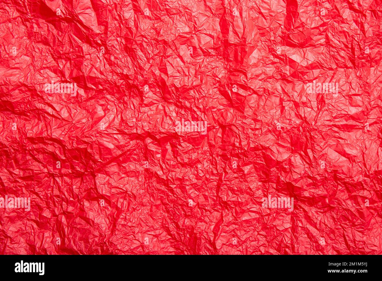 Empty red crumpled silk paper background, lot of copy space. Studio ...