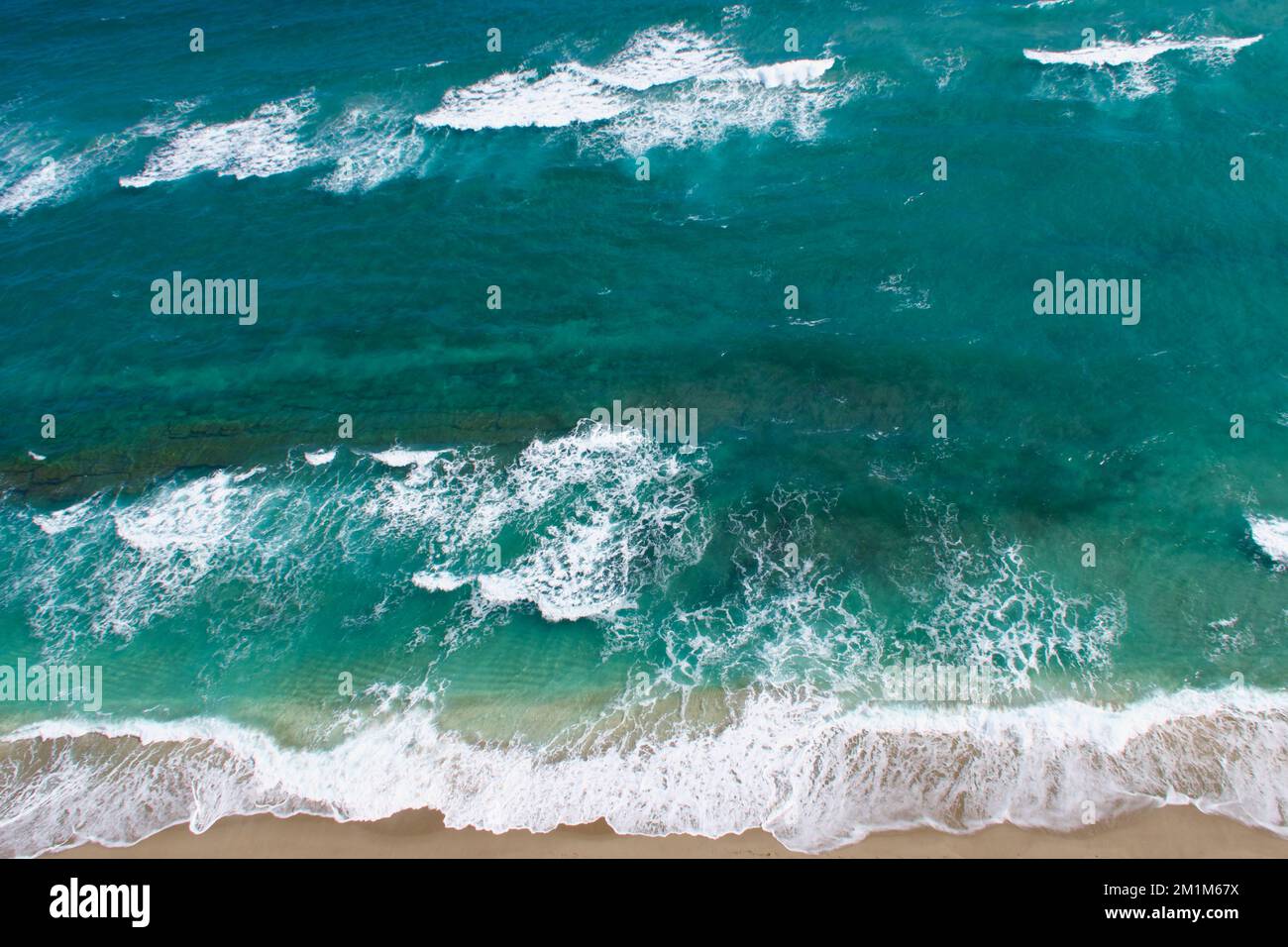 An aerial view of ocean waves with foam in Singer Island, Florida, USA ...