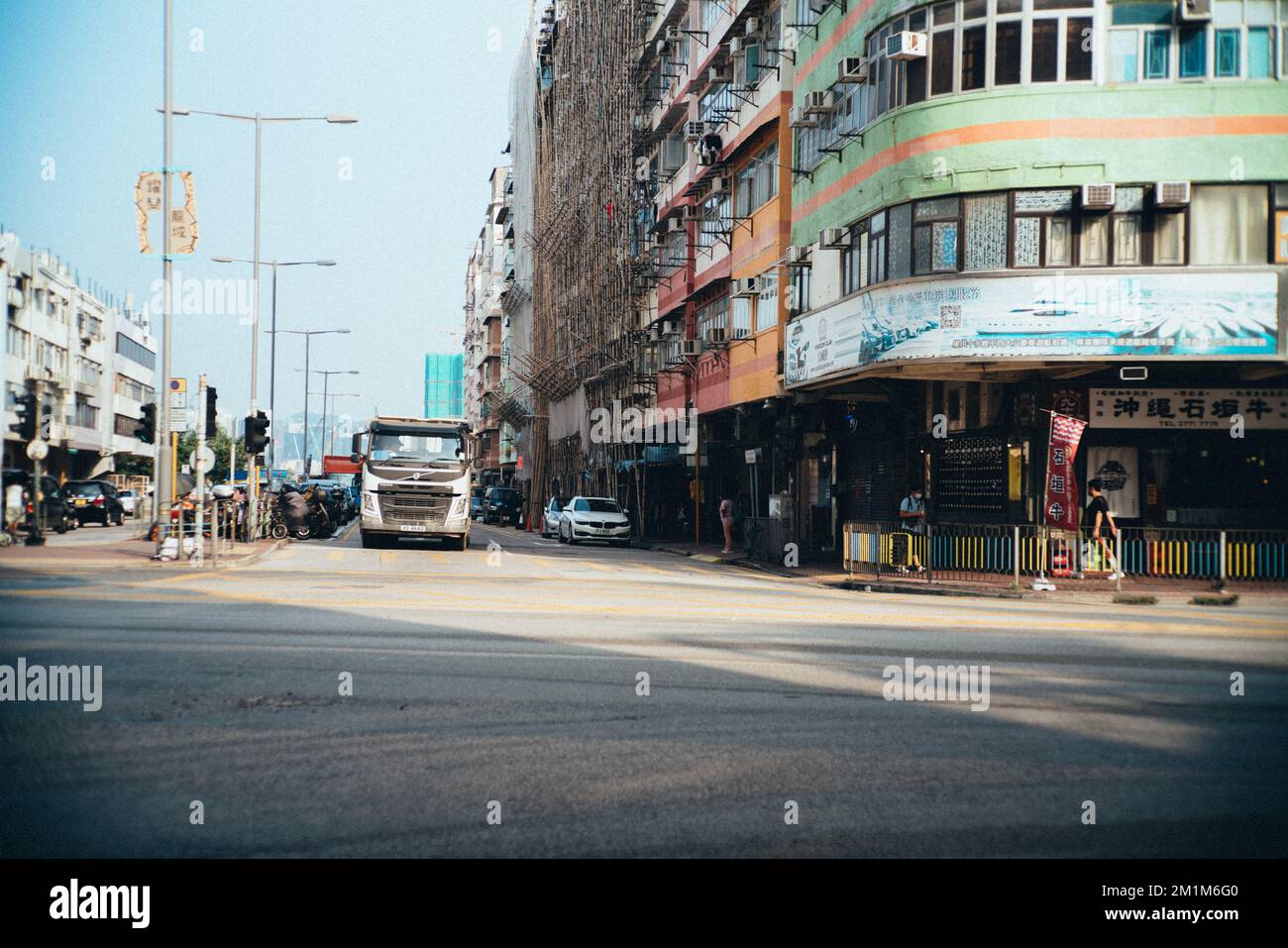 A landscape of a street surrounded by buildings and shops in Hong Kong ...
