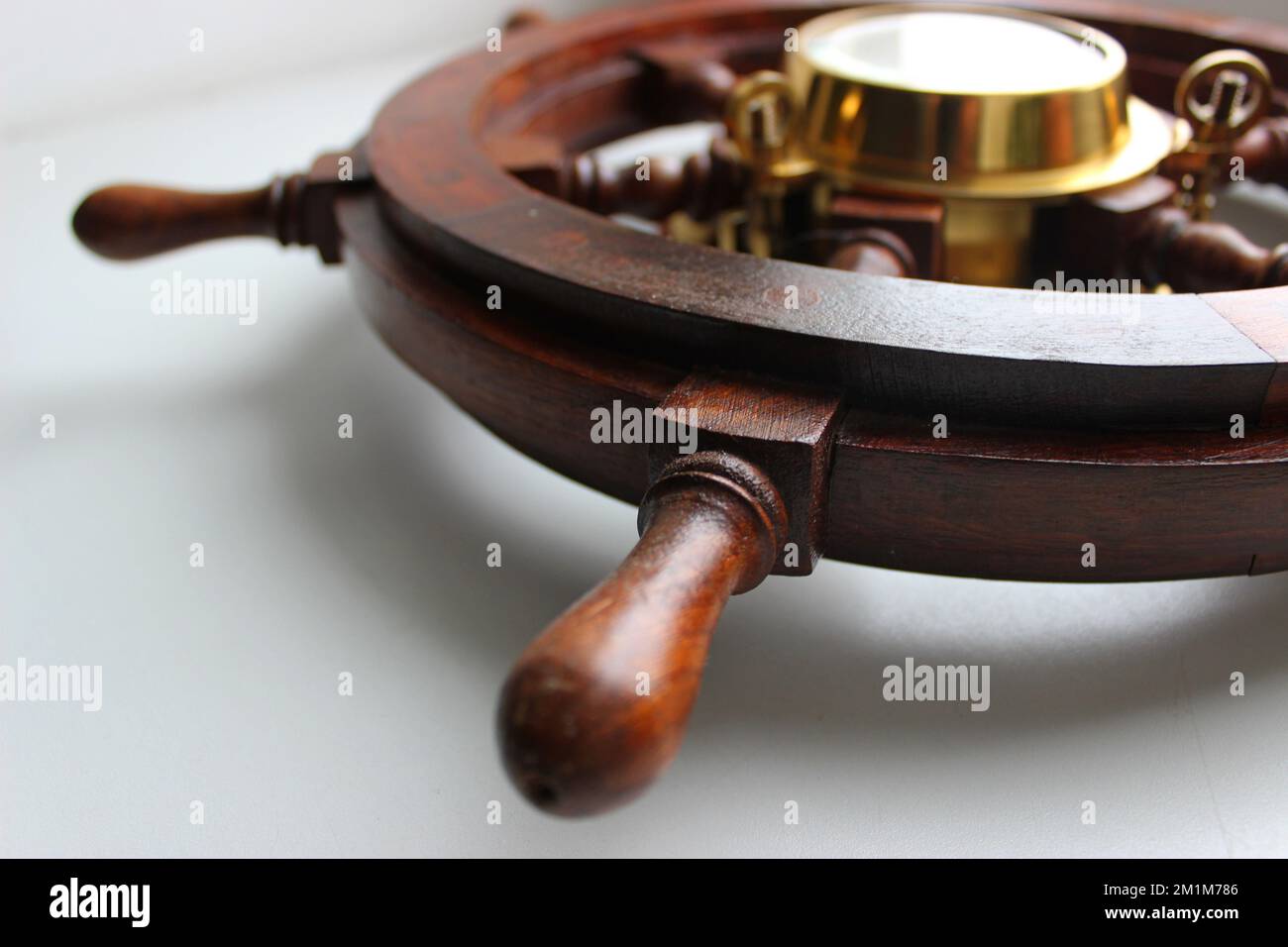 Sailboat steering wheel with a compass in the center side view on white ...