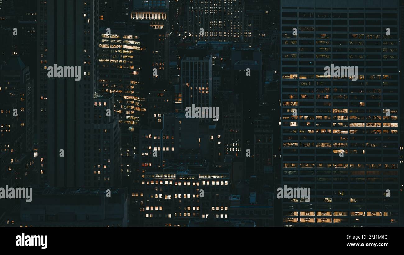 Offices with lighted windows at night in New York city Stock Photo - Alamy