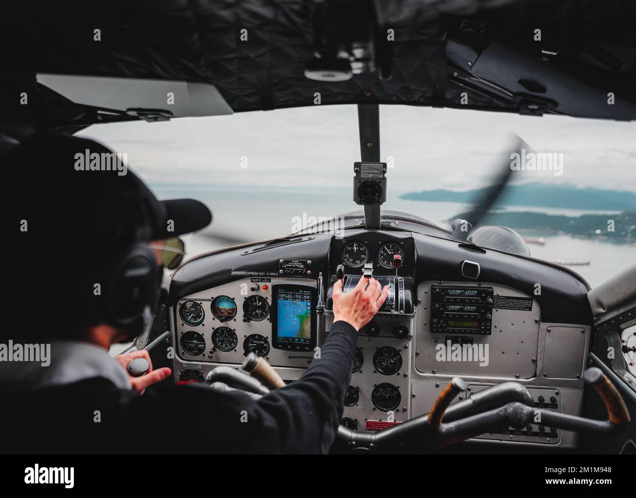 Inside an hydroplane in Vancouver. The pilot is pushing some "things ...