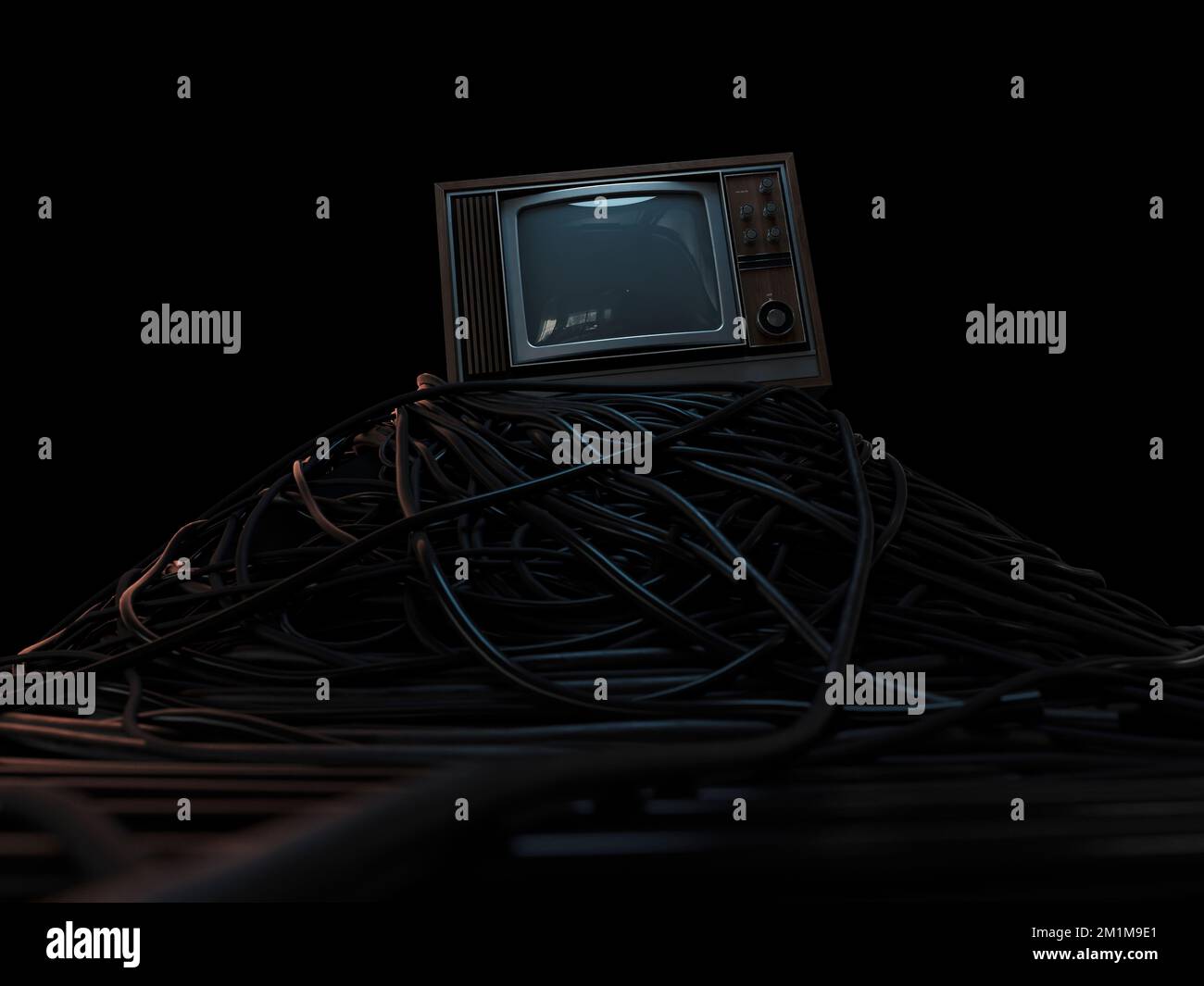 A vintage 80's television perched on a jumbled pile of black cables on ...