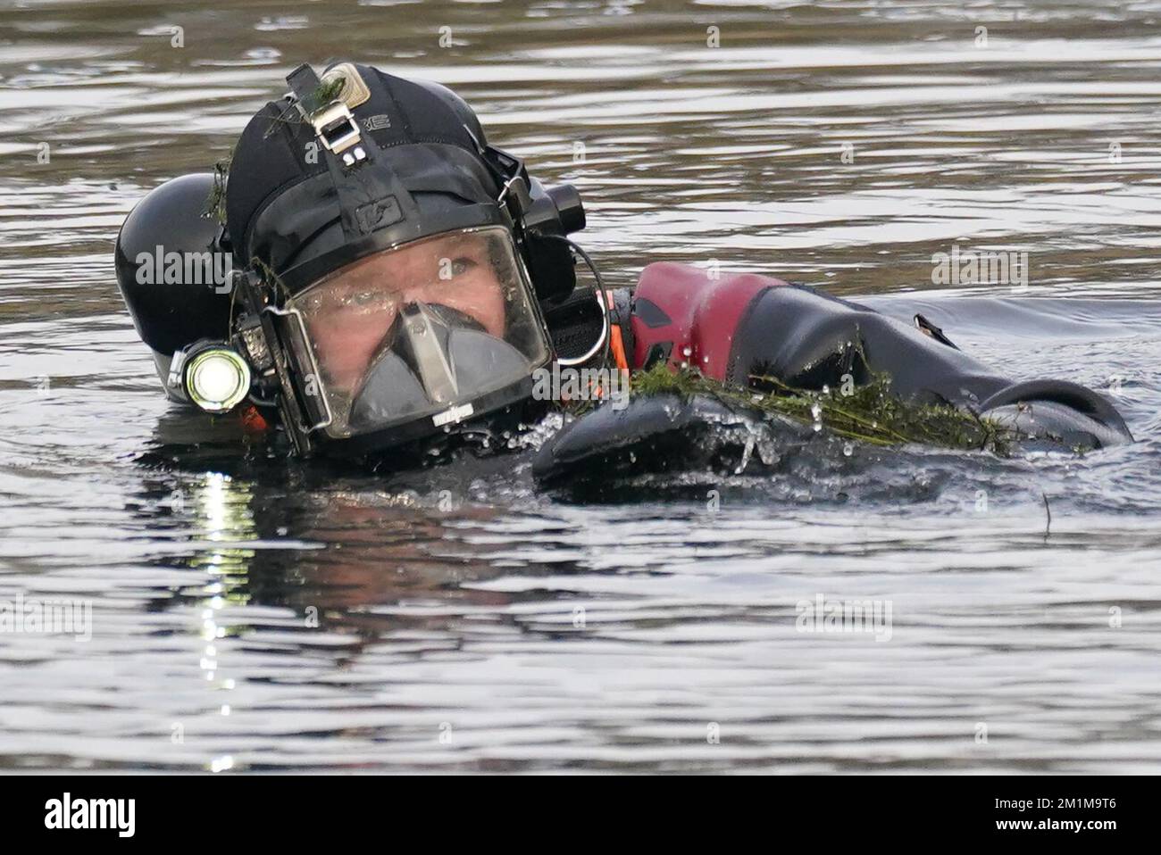 A police diver searches the lake in Babbs Mill Park in Kingshurst ...