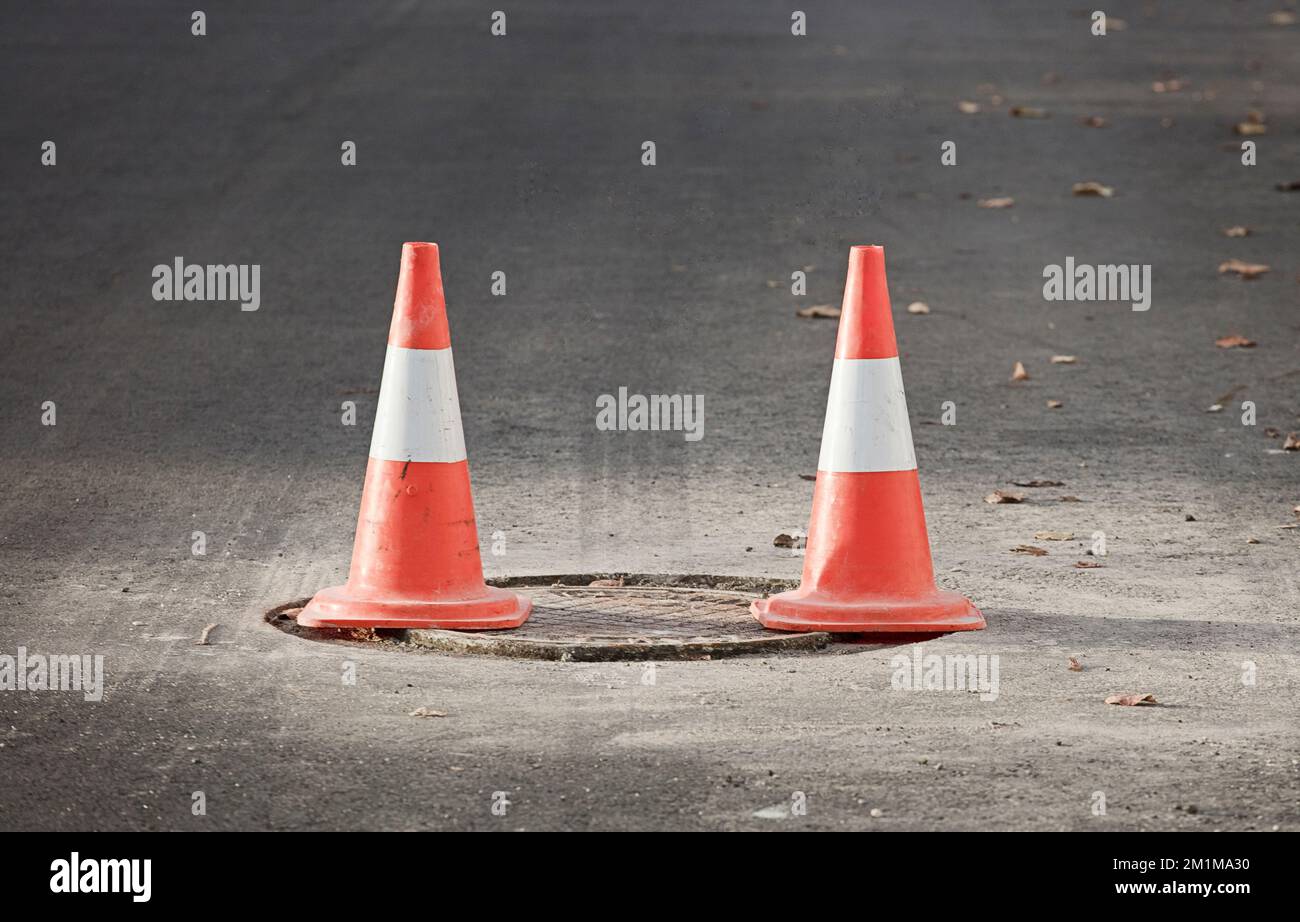 road hazard signaling cones. on road maintenance works Stock Photo - Alamy