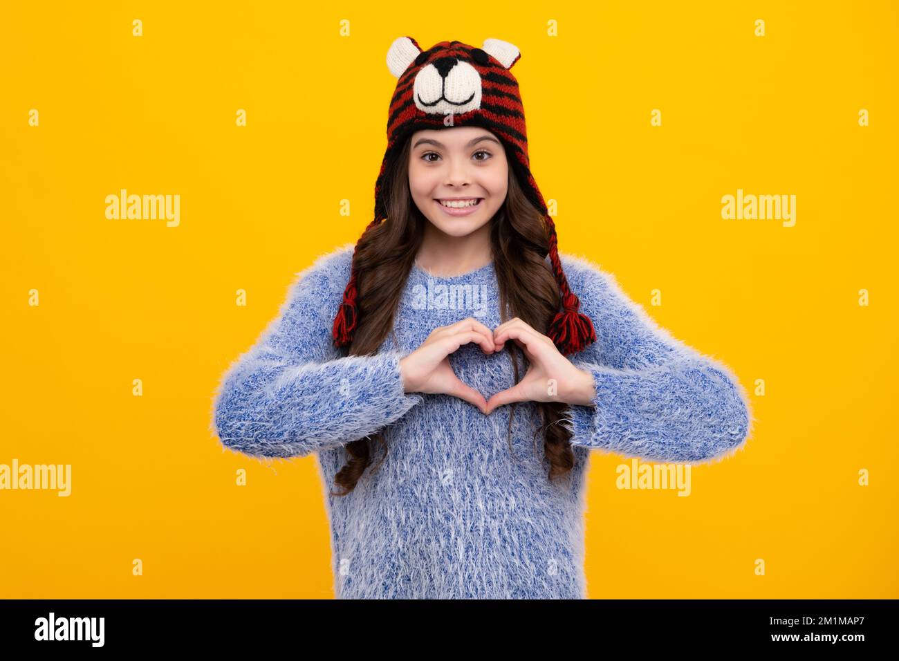 Fashion happy young woman in knitted hat and sweater having fun over ...