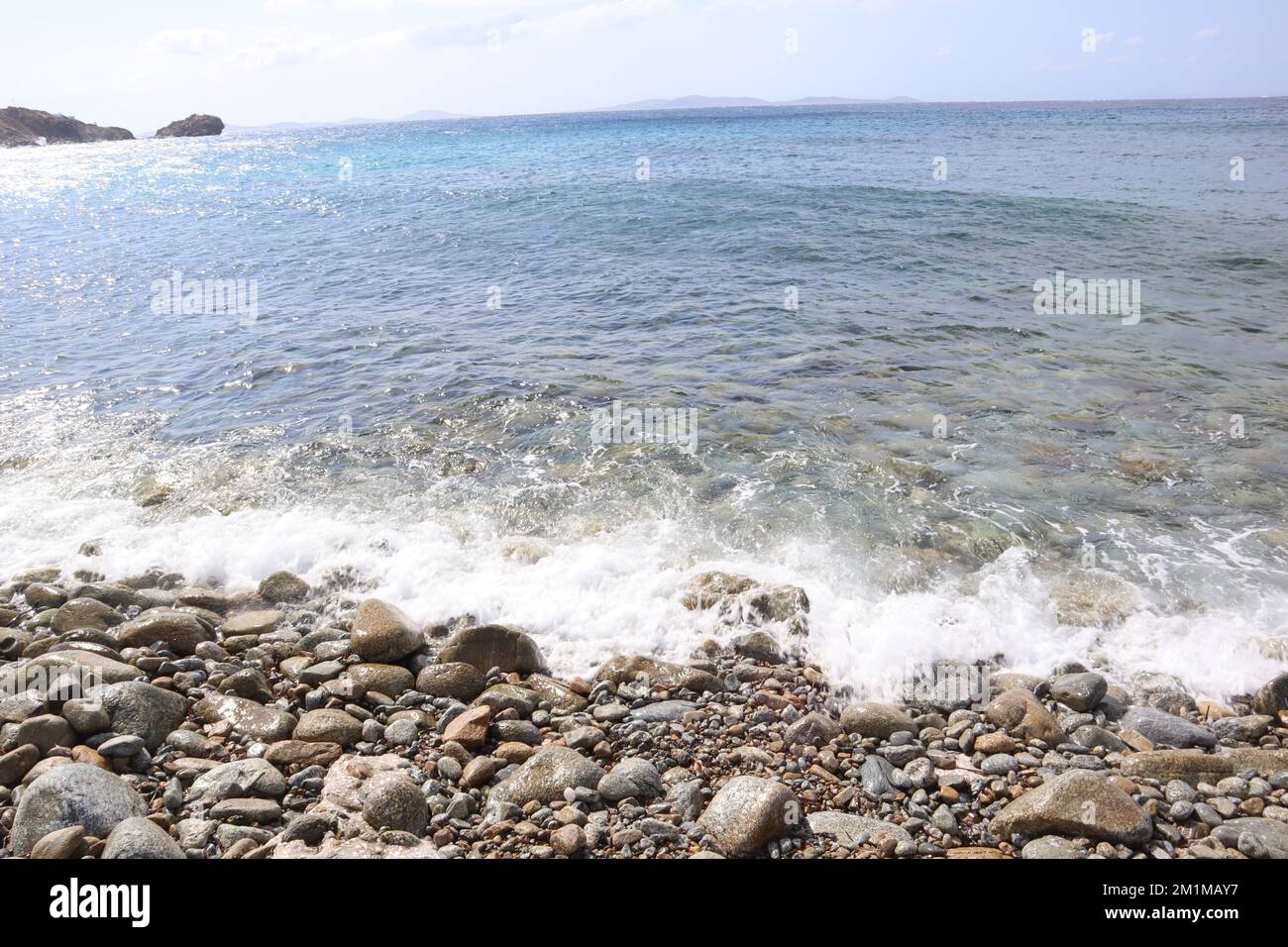 Rocky area of a protected beach from on the wall Stock Photo - Alamy