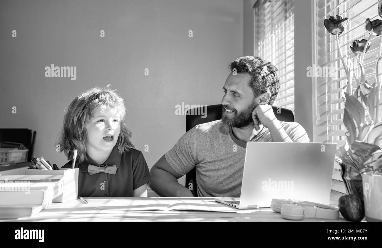 homeschooling and elearning. back to school. father and son use modern ...