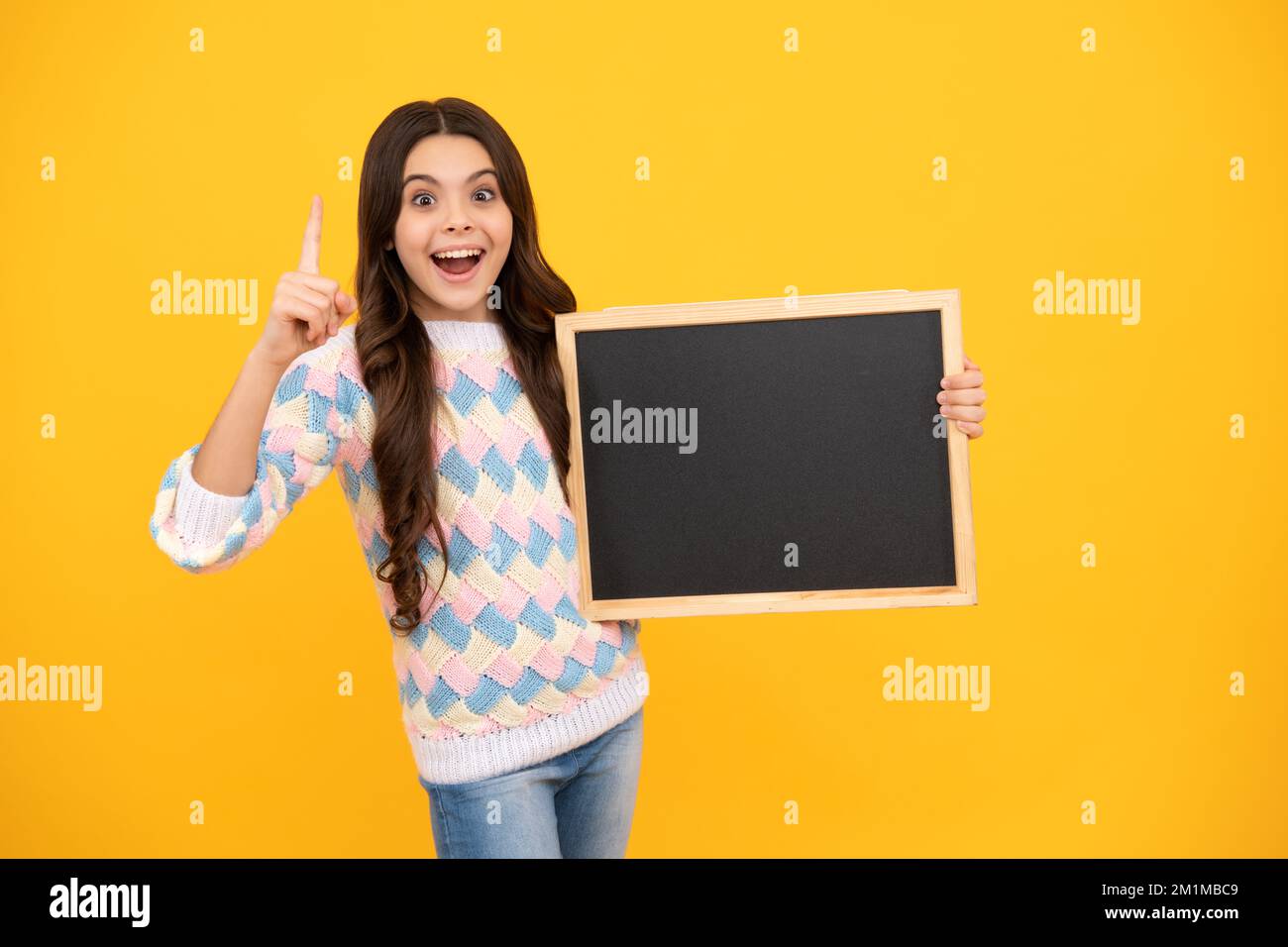 School sales board. Cheerful teenage girl kid hold blackboard ...