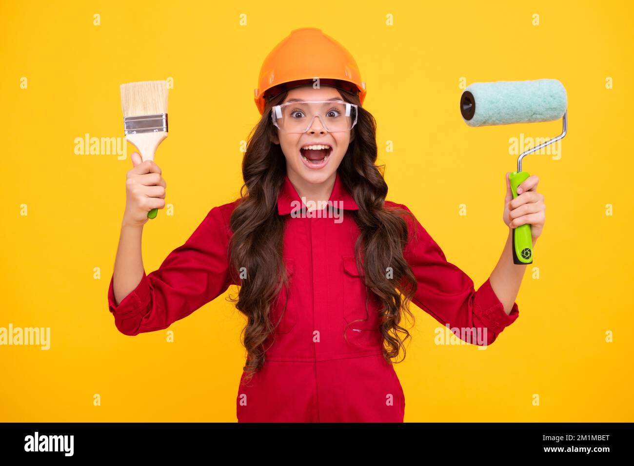 Excited teenager girl. Building, construction and profession concept ...