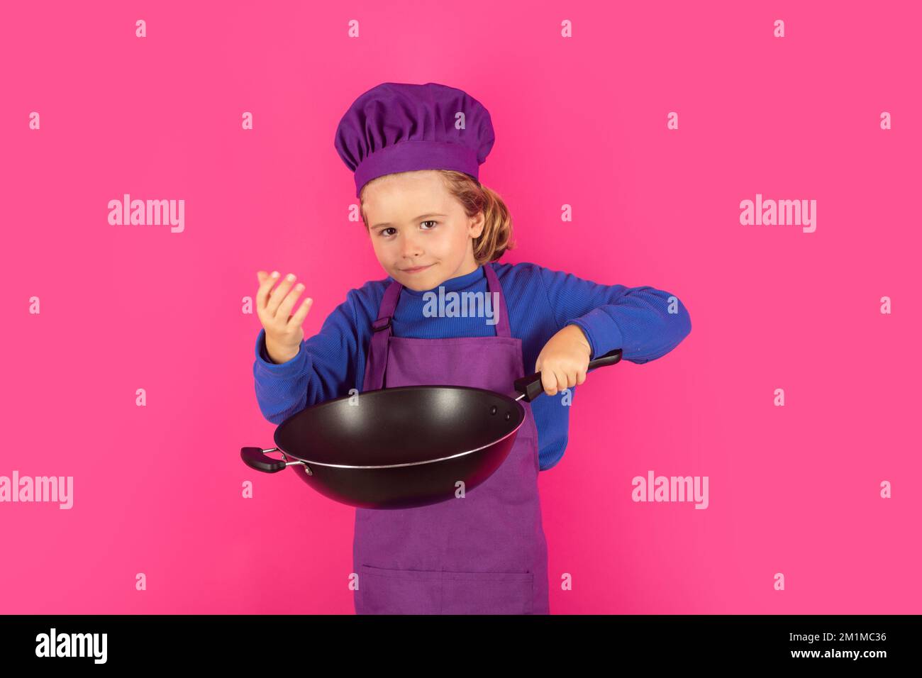 Kid cook with cooking pan. Chef kid preparing healthy food. Portrait of ...