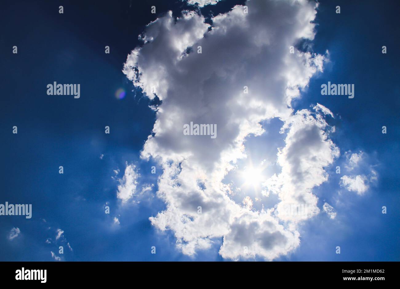 natural clouds blue sky sun ray light Stock Photo - Alamy
