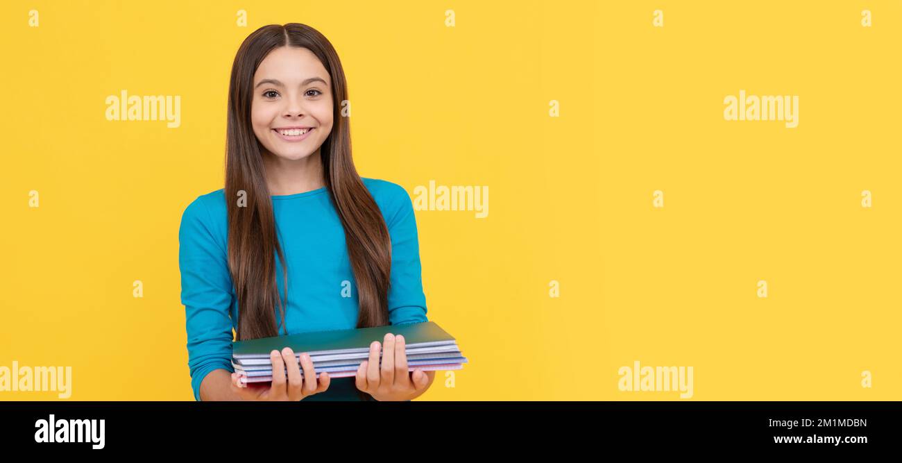 cheerful child girl hold notepad for homework, education. Banner of ...