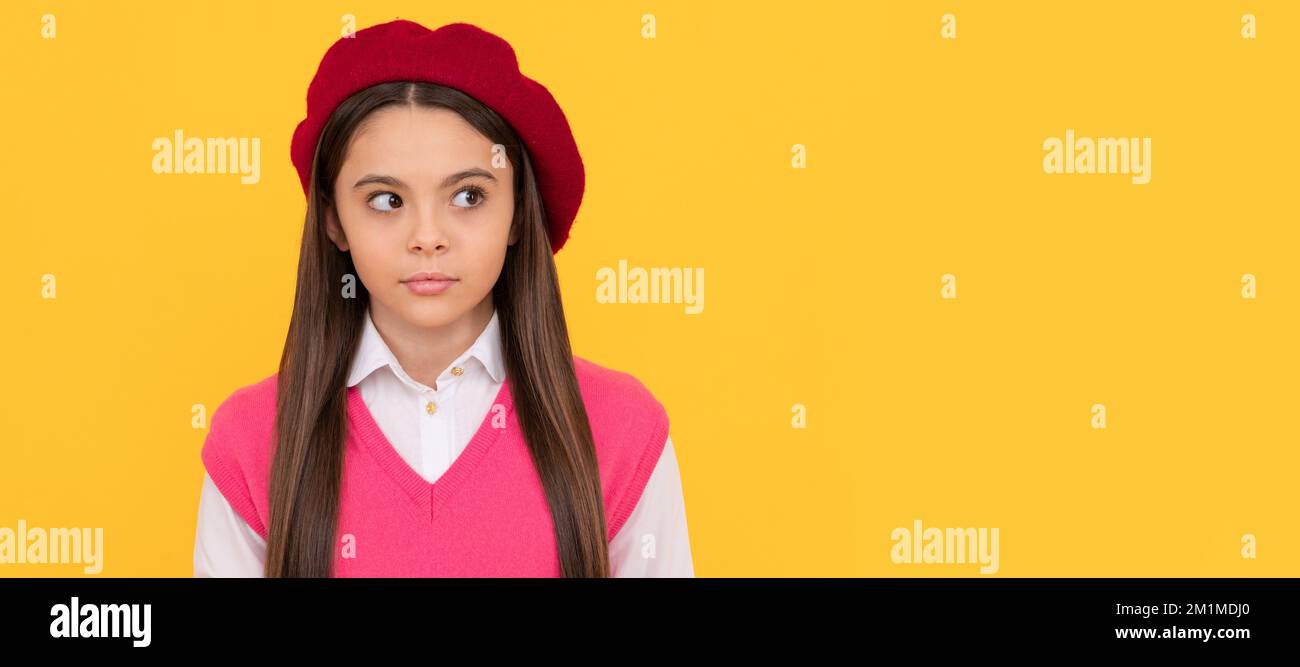 kid looking away. serious kid in beret. child has long hair. skin ...