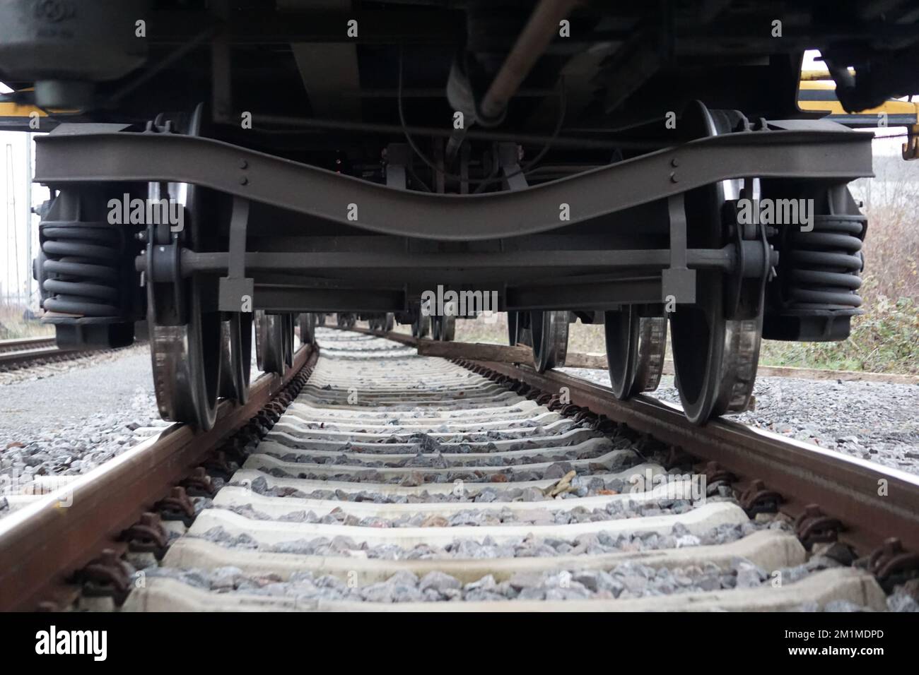 A closeup of the wheels of black old train on the railway track Stock ...