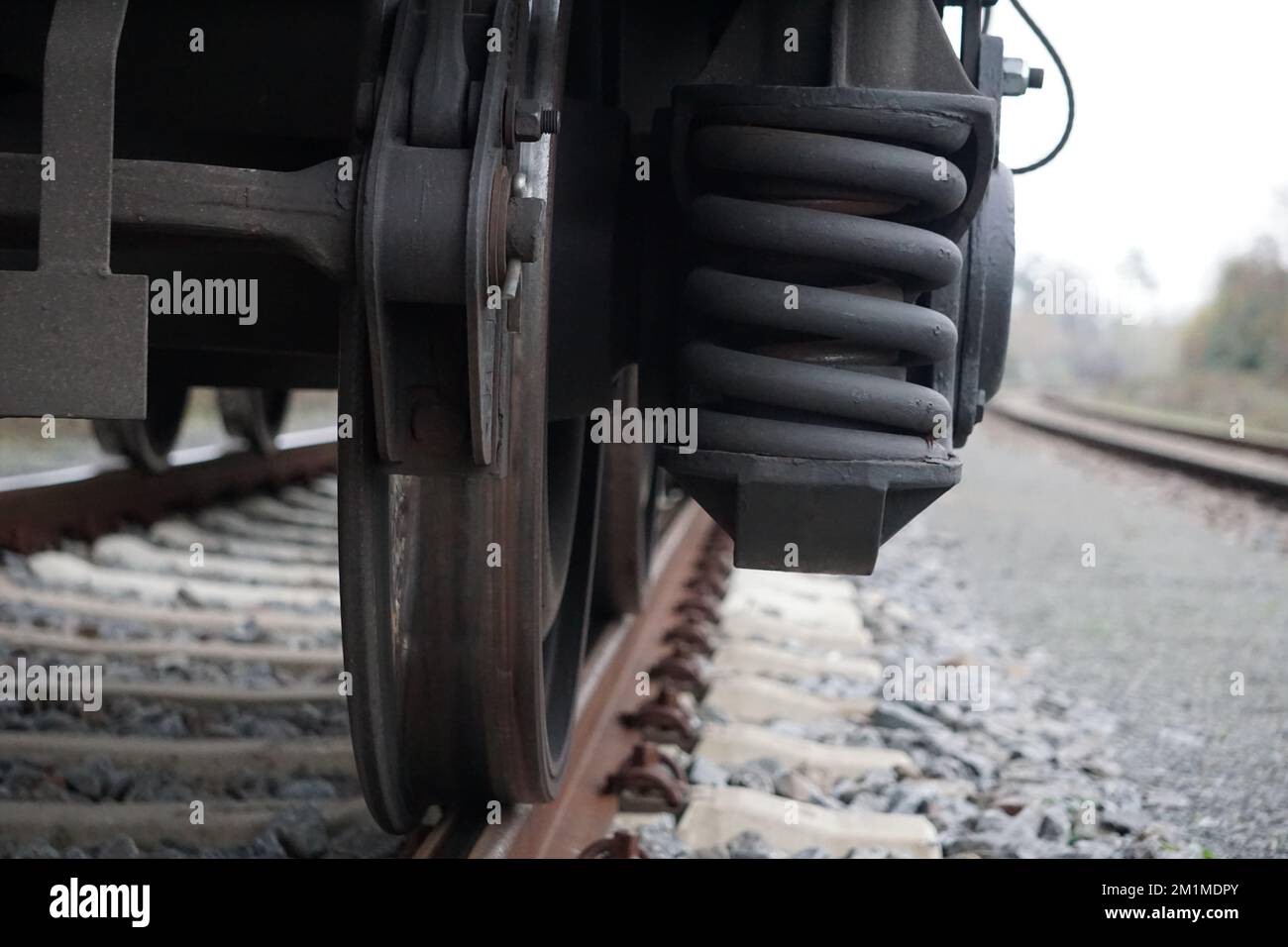 A closeup of the wheels of black old train on the railway track Stock ...